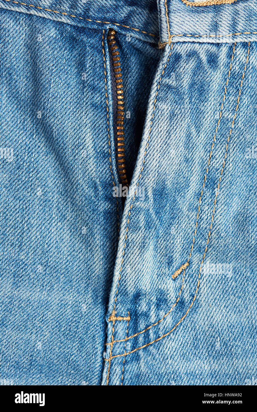 Open zipper on light blue jeans close up Stock Photo - Alamy