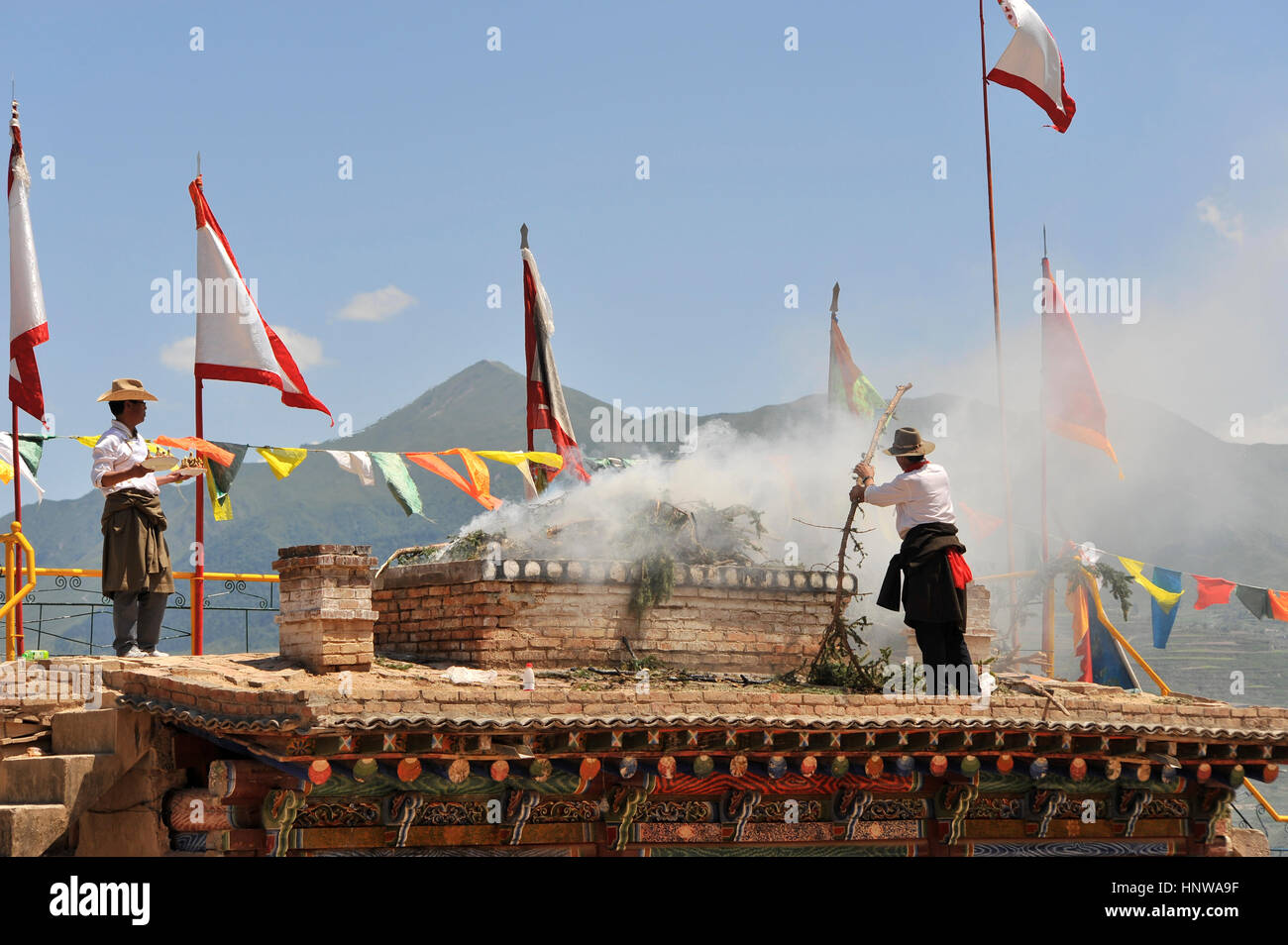 Tibetan culture: Juniper branches burning on a sacrificial pyre at ...
