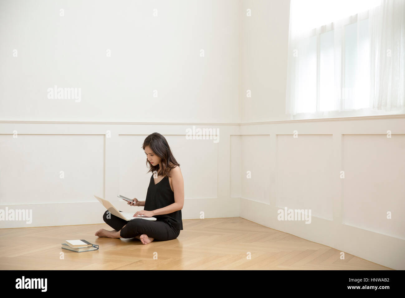 Side view of young woman bored Stock Photo - Alamy