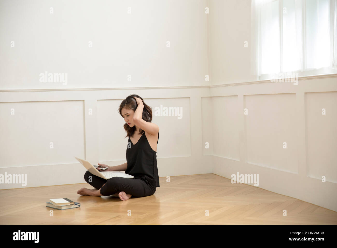 Young woman bored sitting Stock Photo - Alamy