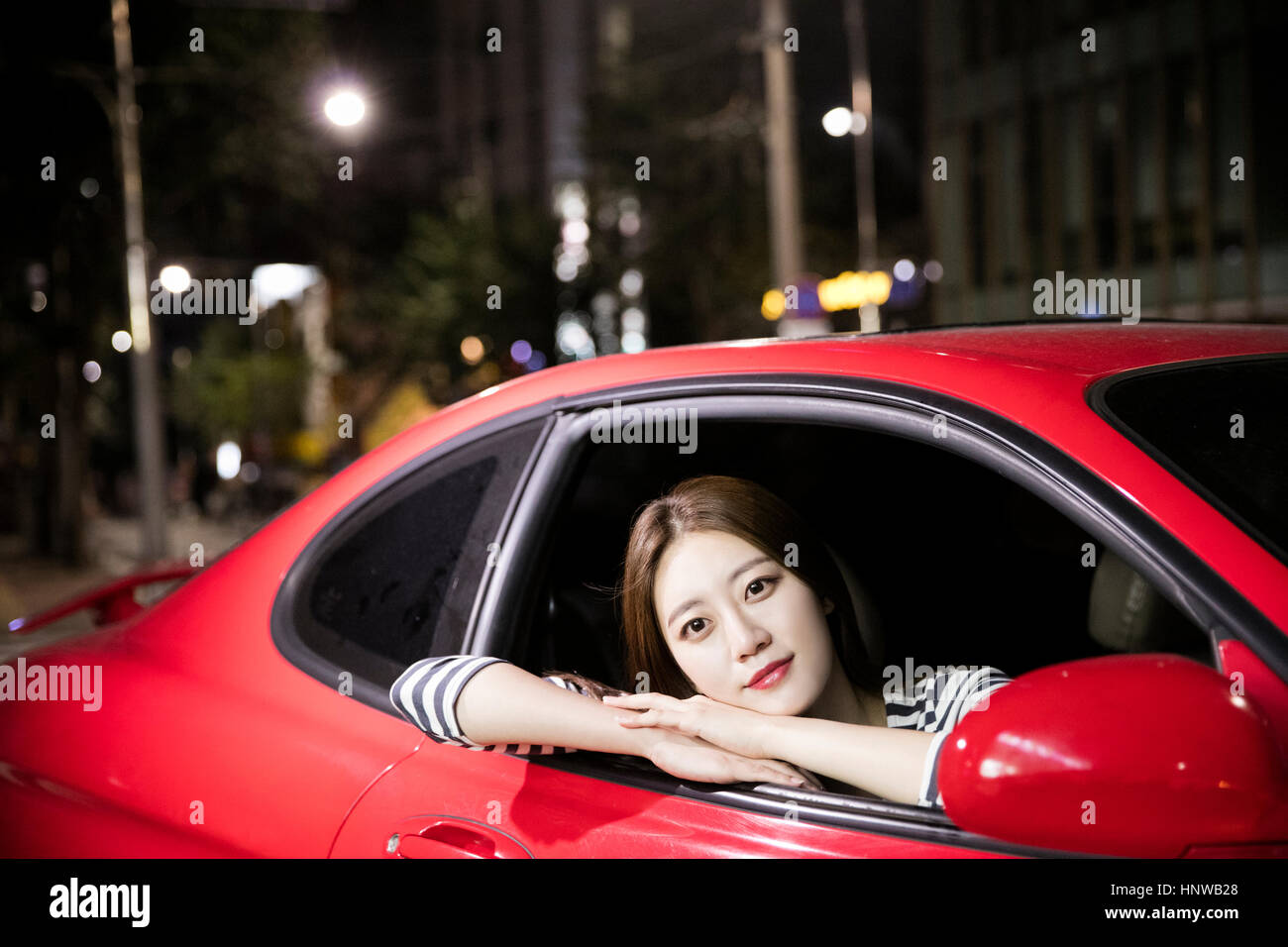 Portrait of woman in a car Stock Photo - Alamy