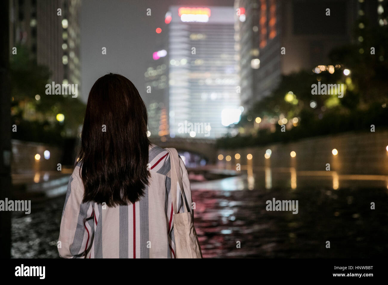Back view going woman hi-res stock photography and images - Alamy