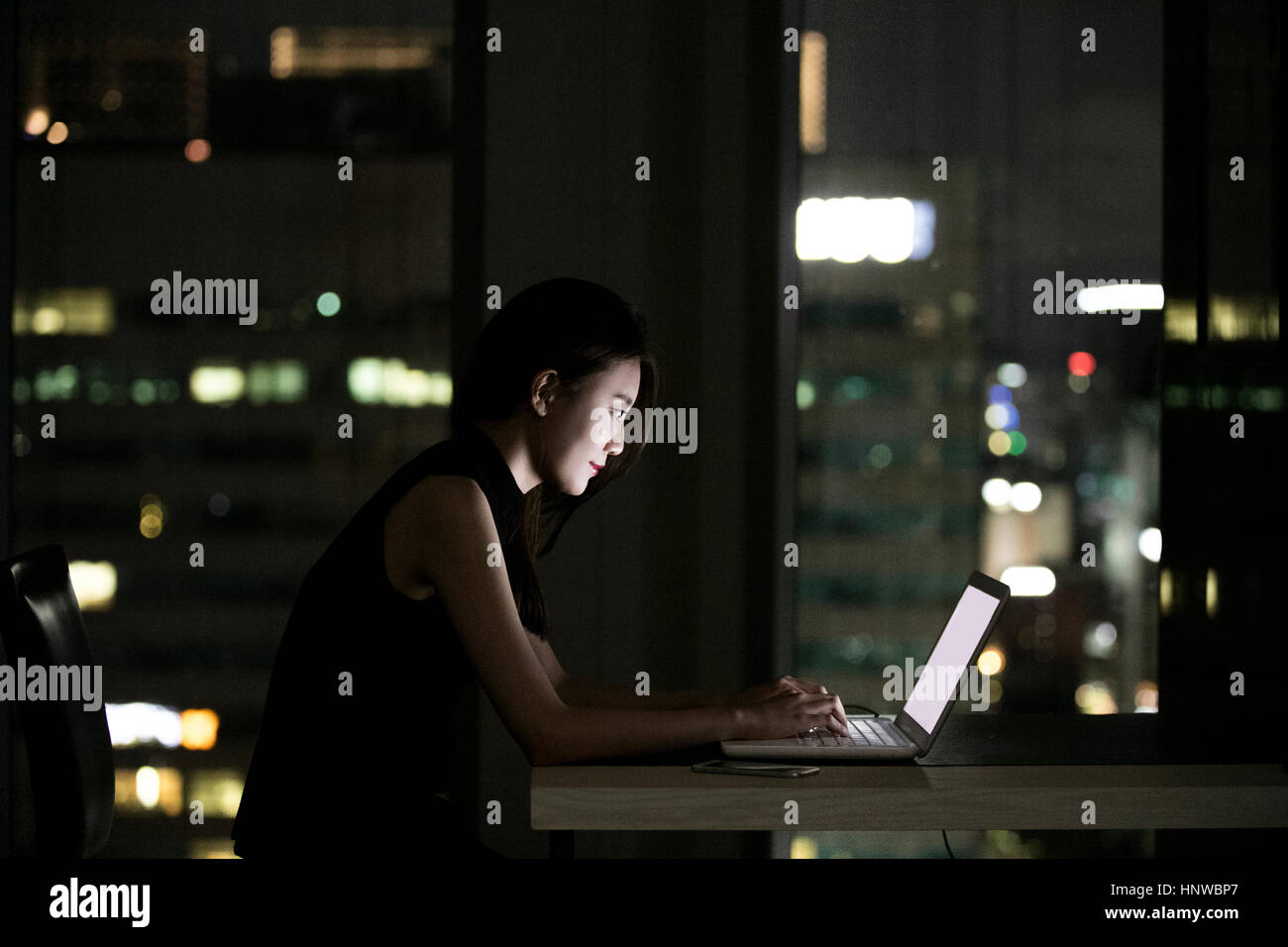 Side view young woman typing hi-res stock photography and images - Alamy