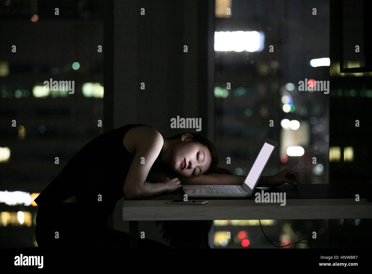 Young woman sleeping with notebook computer Stock Photo - Alamy