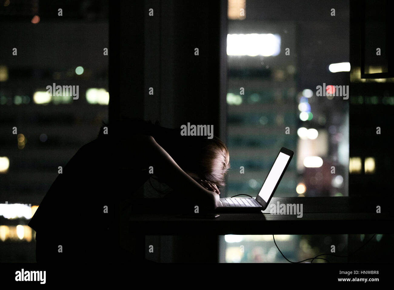 Young woman sleeping with notebook computer Stock Photo - Alamy