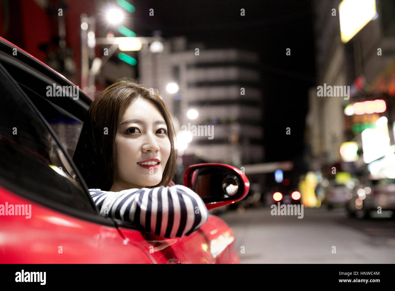 Young woman looking out in a car Stock Photo - Alamy