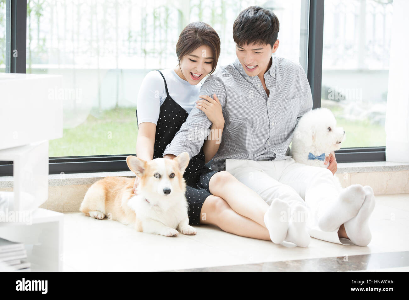 Harmonious couple with pets Stock Photo - Alamy