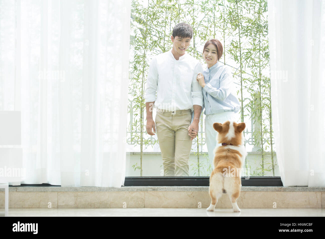 Couple with pet Stock Photo - Alamy