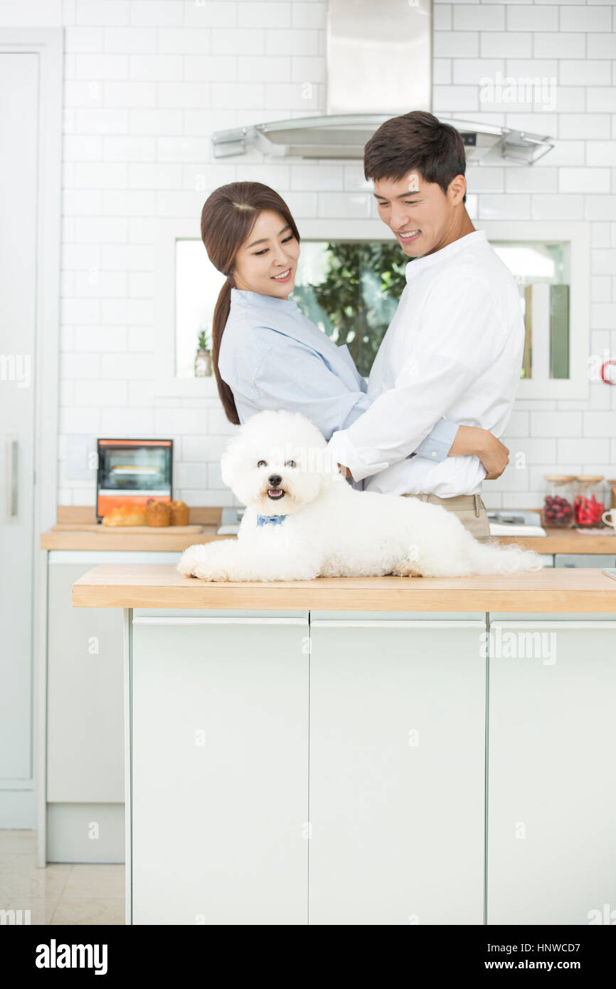 Harmonious couple with pet Stock Photo - Alamy