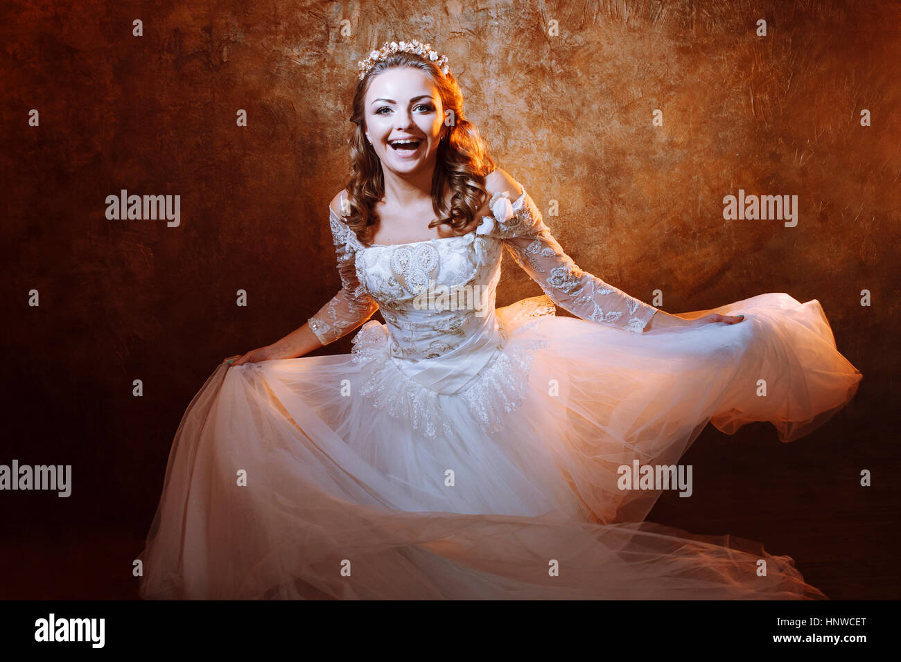 Beautiful girl bride in a luxurious wedding dress, portrait in Golden ...