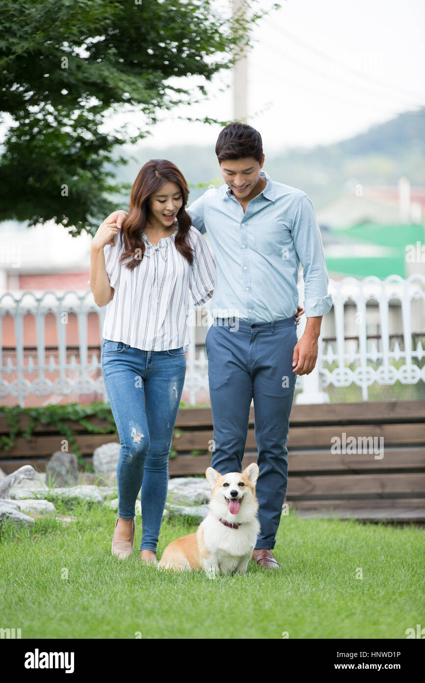 Harmonious couple with pet dog Stock Photo - Alamy