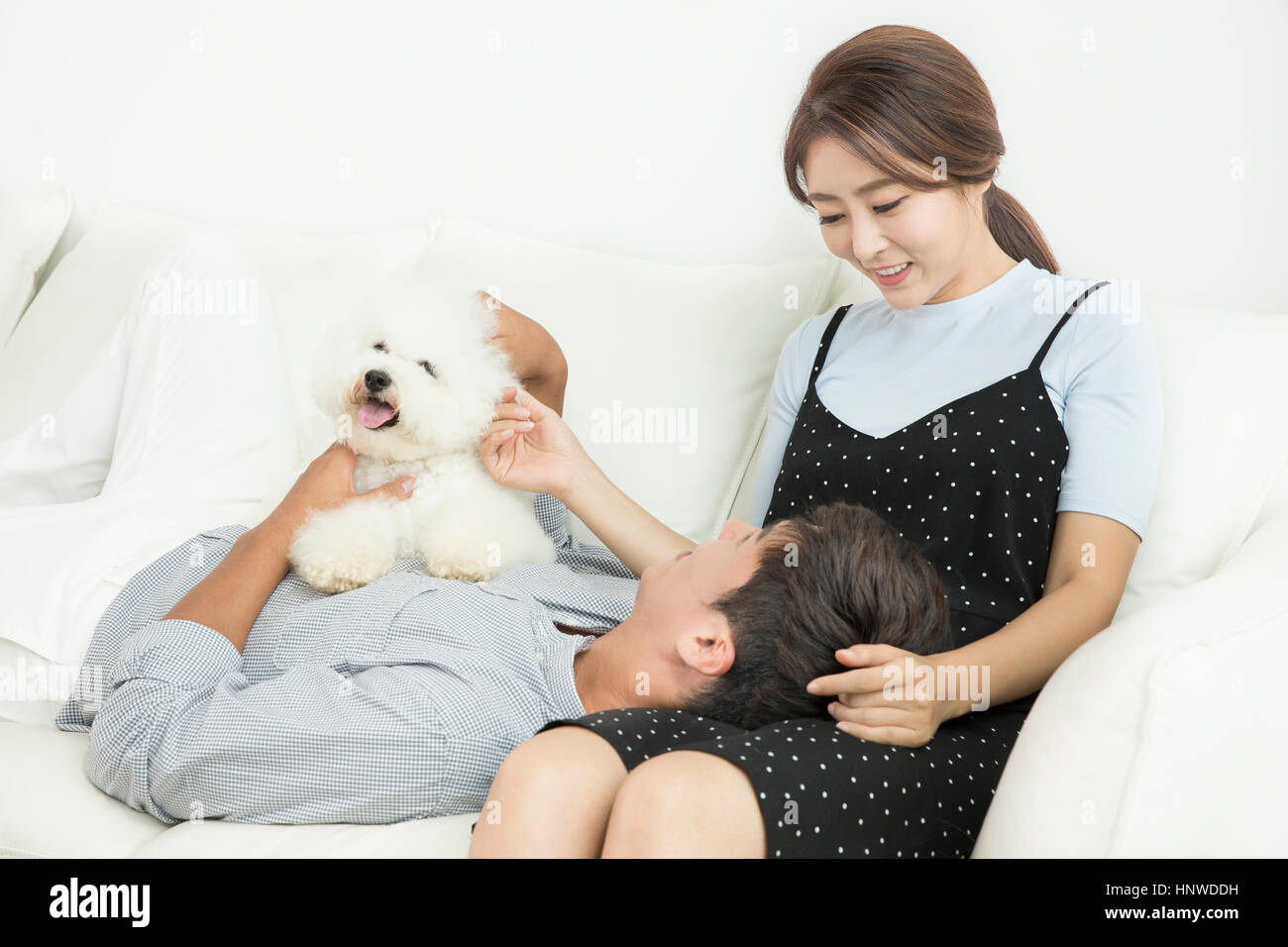 Harmonious couple with pet dog Stock Photo - Alamy
