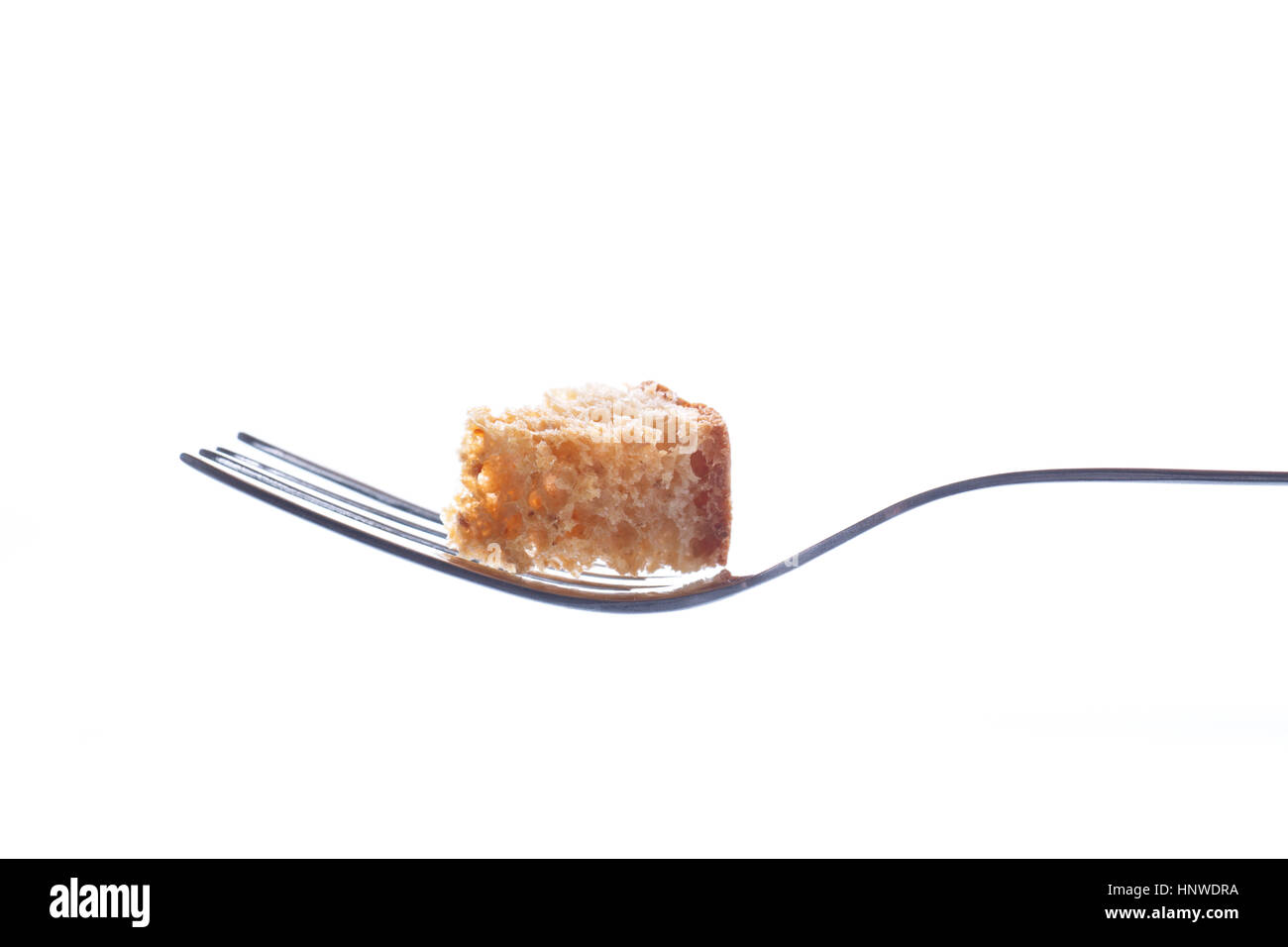 grain toast with a fork on a white background Stock Photo - Alamy