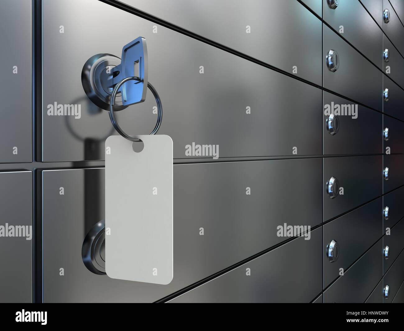 Safe deposit boxes in bank, a closeup of a key with an blank label in ...