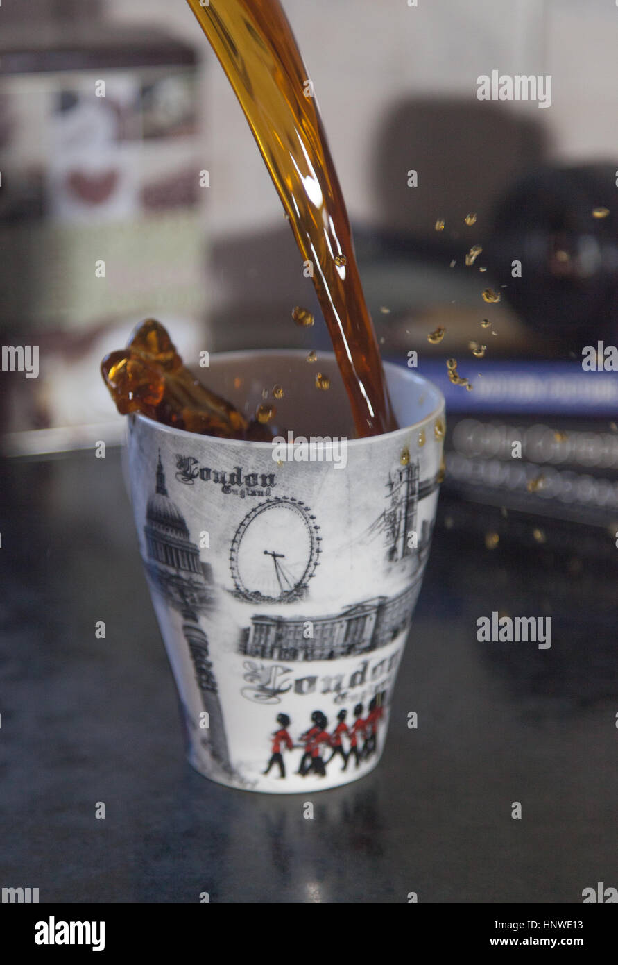 Cup coffee creating splash white hi-res stock photography and images ...