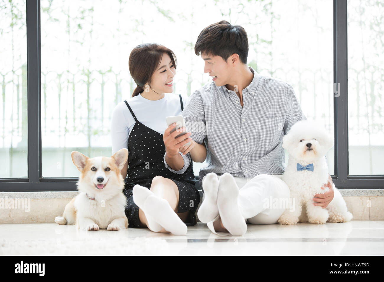 Harmonious couple with pets Stock Photo - Alamy