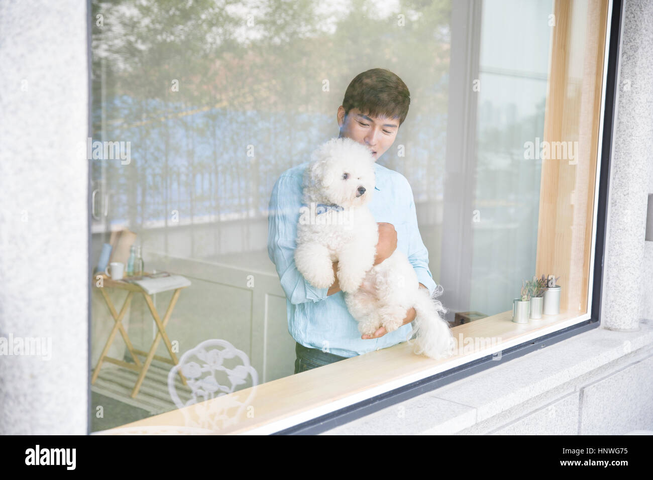 Man hugging a pet dog Stock Photo - Alamy