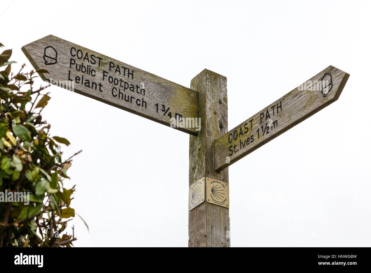 A wooden sign post for the coast path between Lelant church and St ...