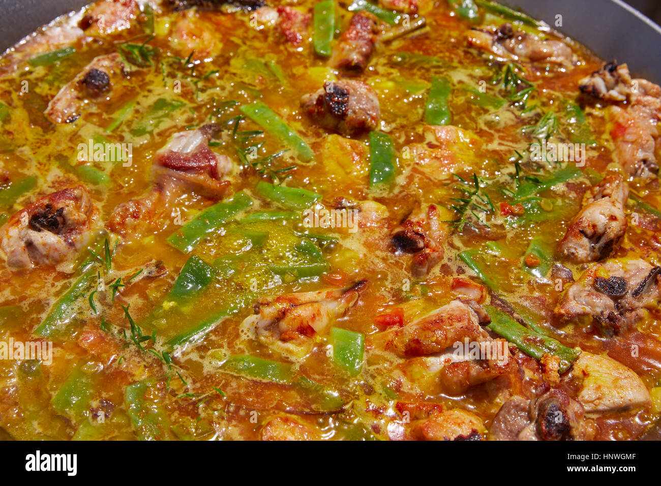 Paella from Spain recipe process boiling broth step by step Stock Photo ...