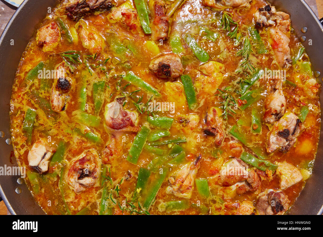 Paella from Spain recipe process boiling broth step by step Stock Photo ...