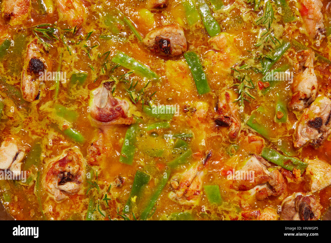 Paella from Spain recipe process boiling broth step by step Stock Photo ...