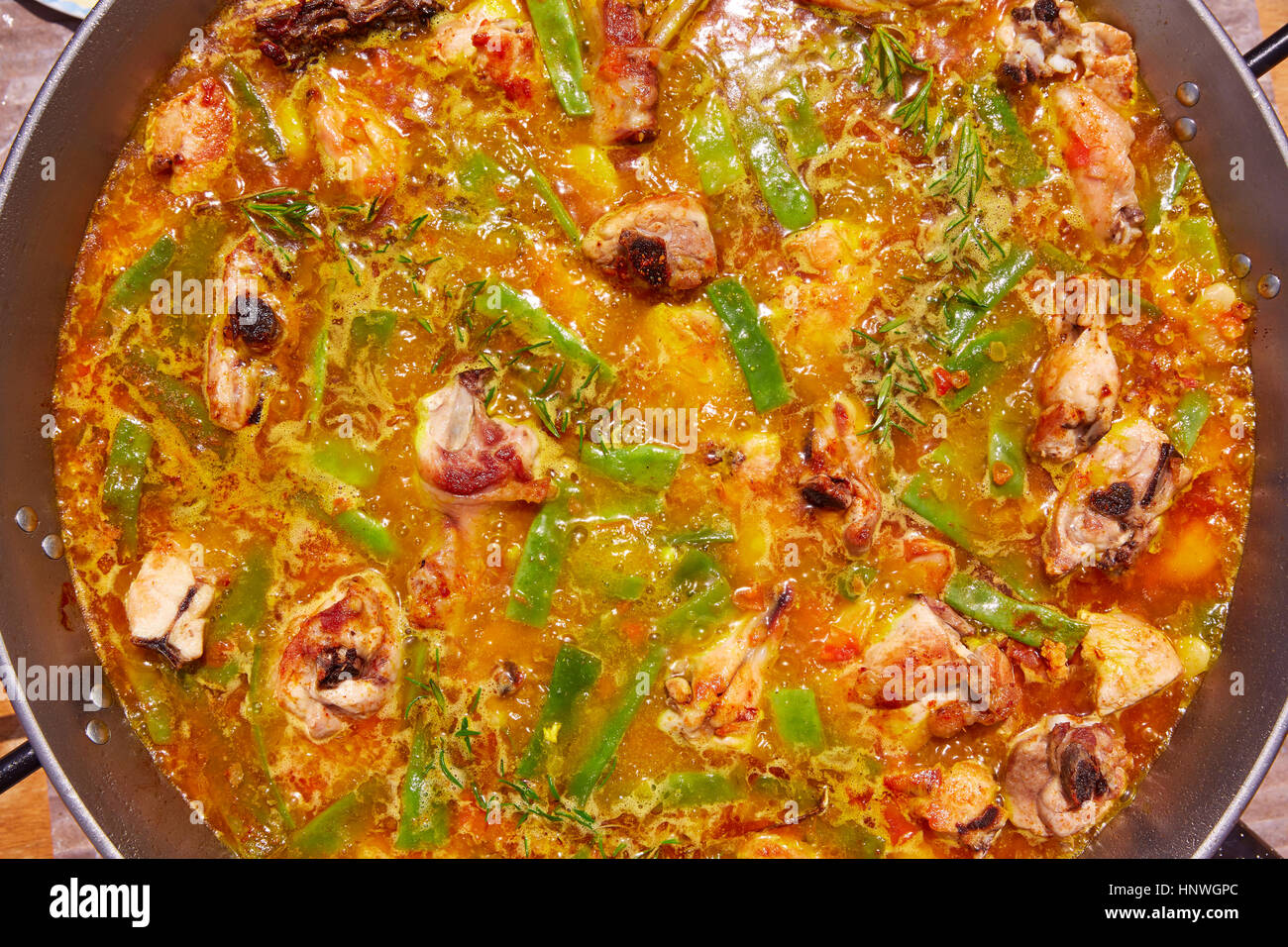 Paella from Spain recipe process boiling broth step by step Stock Photo ...