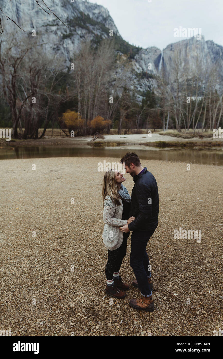 Romantic hiking couple by lake, Yosemite National Park, California, USA ...