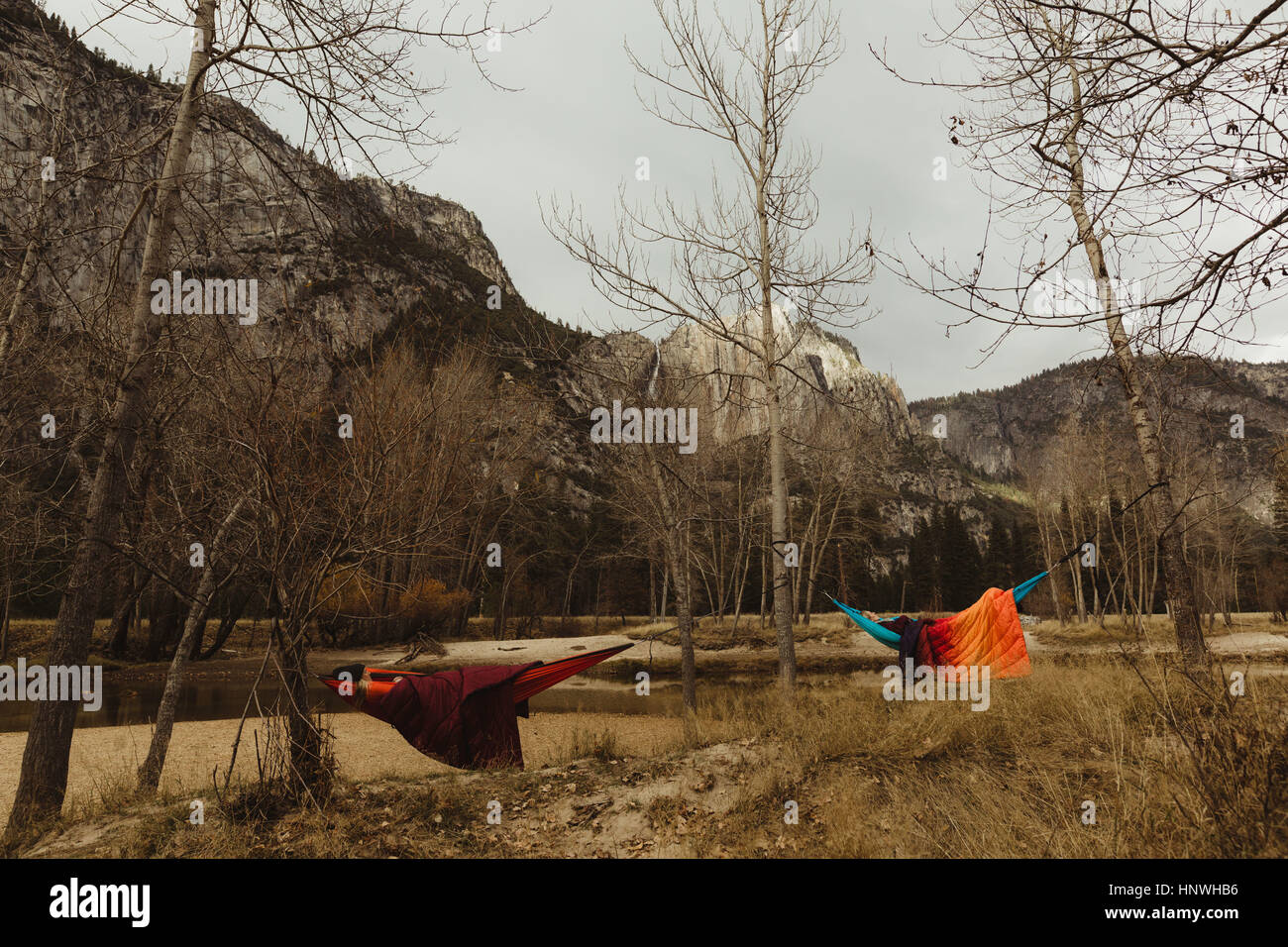 Two women reclining in hammocks at Yosemite National Park, California ...