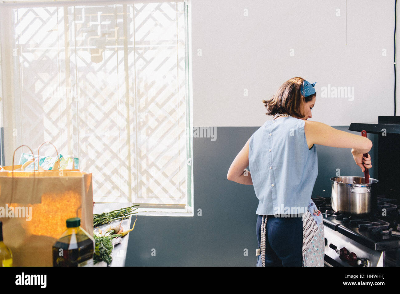 Woman wearing cooking apron hi-res stock photography and images - Alamy