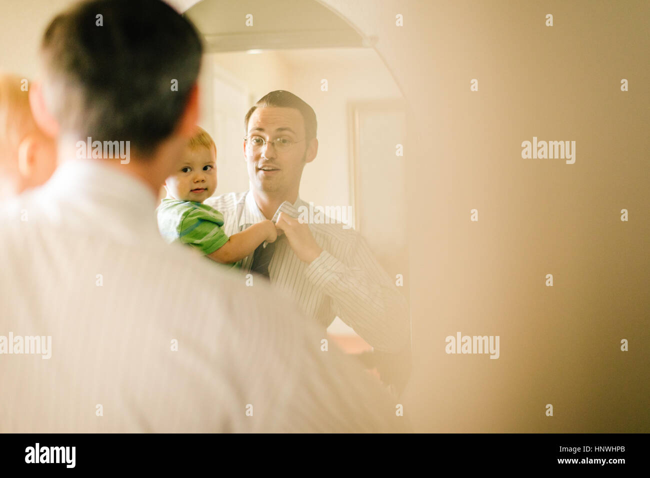 Boy child looking in mirror hi-res stock photography and images - Alamy