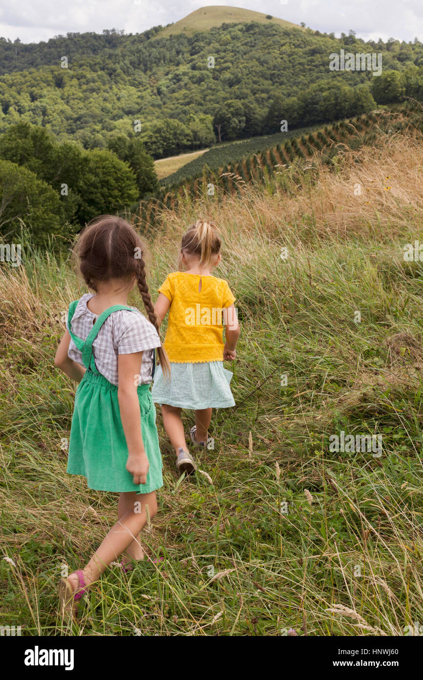 Two young girls exploring outdoors Stock Photo - Alamy