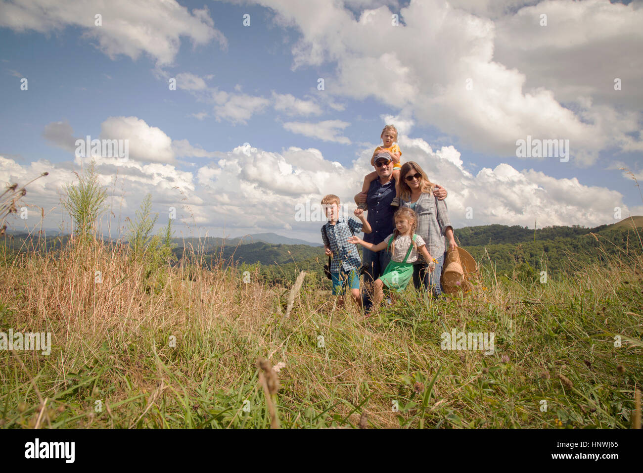 Three children walking through hi-res stock photography and images - Alamy
