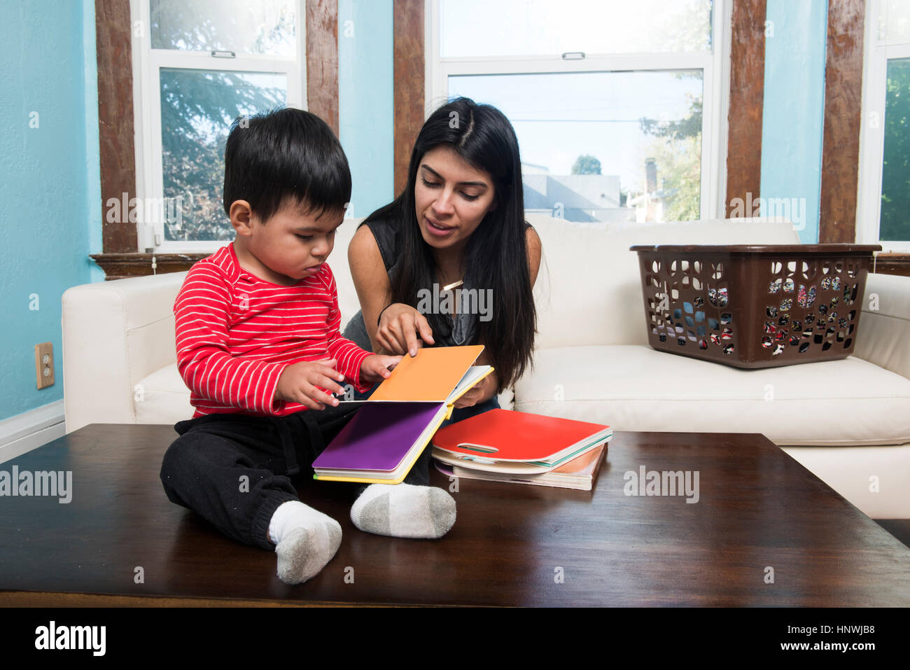 Sitting on coffee table hi-res stock photography and images - Alamy
