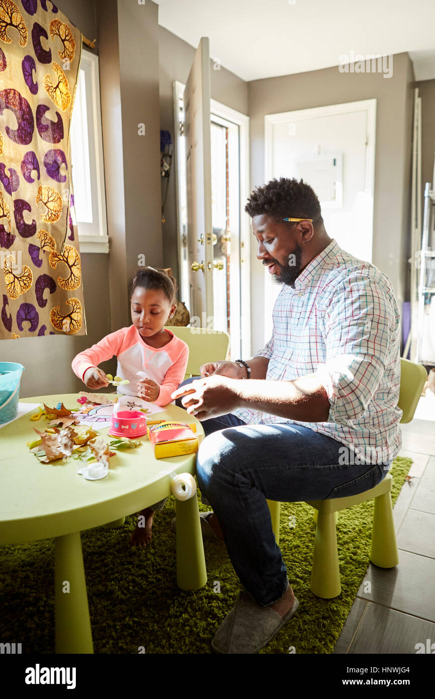 Father and daughter enjoying handicraft activity Stock Photo - Alamy