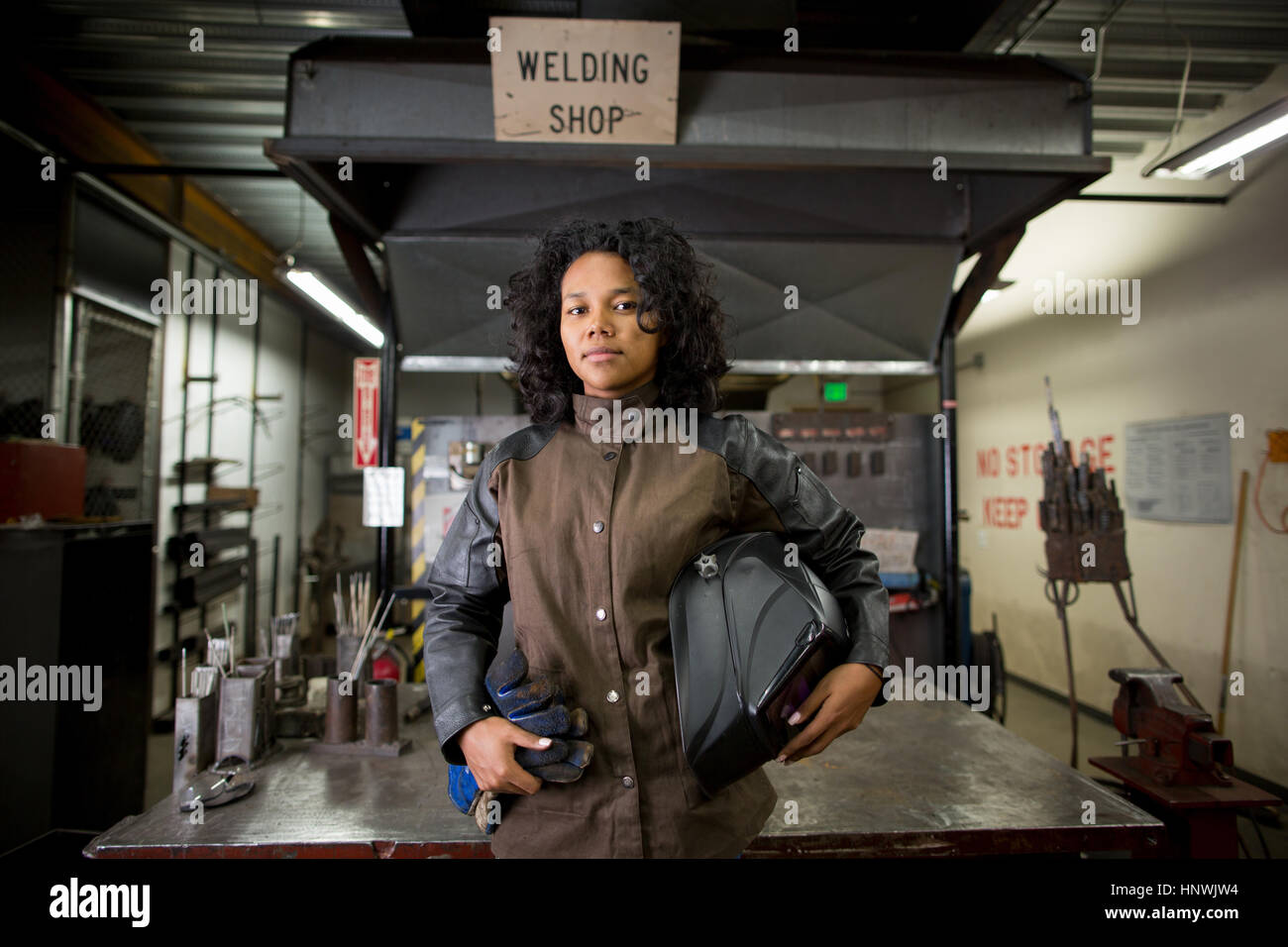 Portrait of young female metalsmith in welding workshop Stock Photo - Alamy