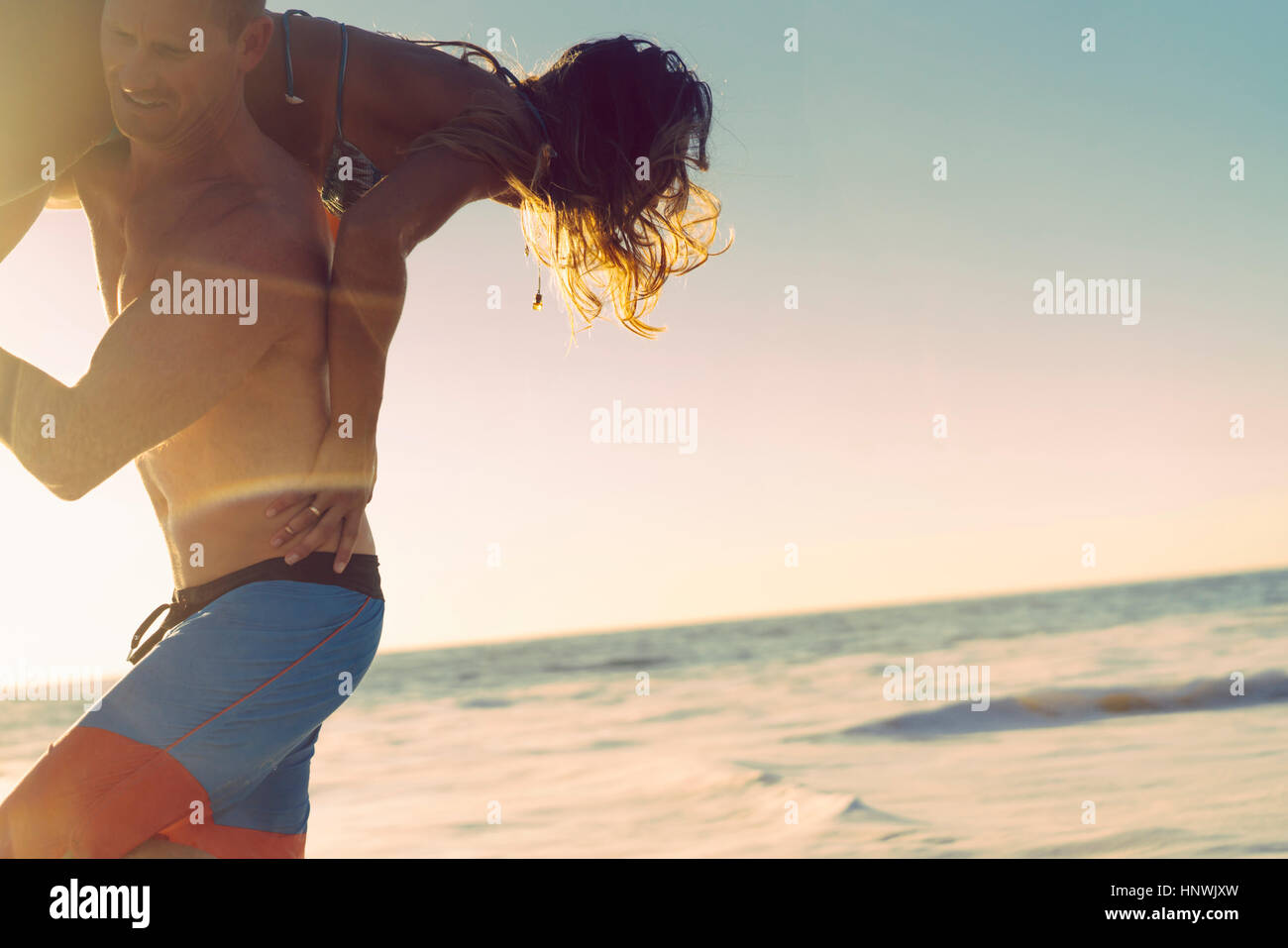 Man Carrying Woman Over Shoulder High Resolution Stock Photography and ...