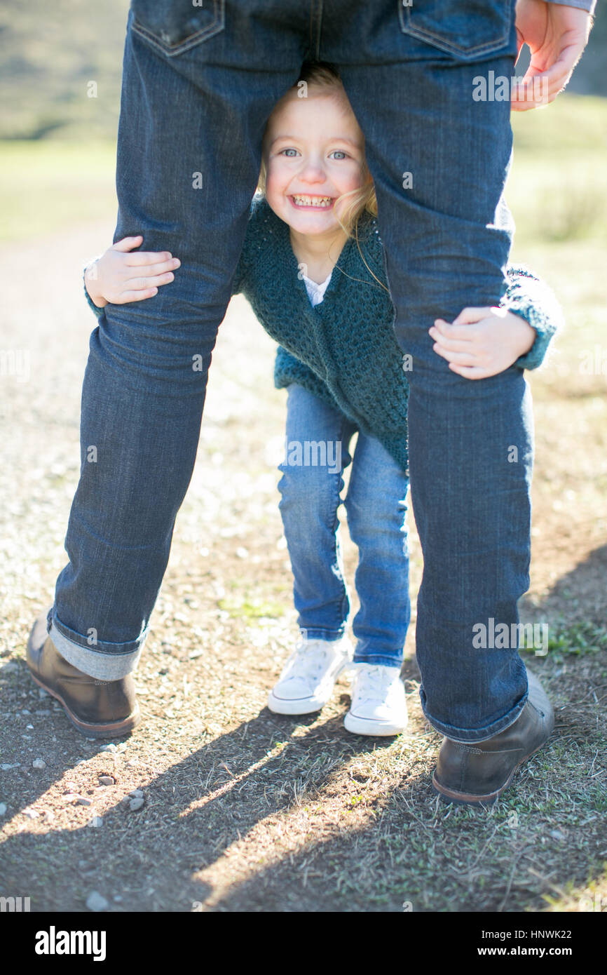 Child between legs her father hi-res stock photography and images - Alamy