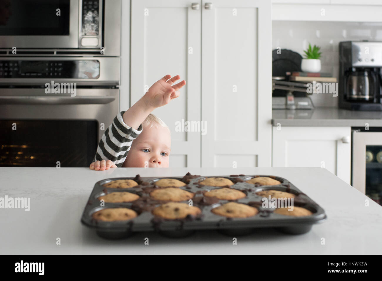 Reaching for cake hi-res stock photography and images - Alamy