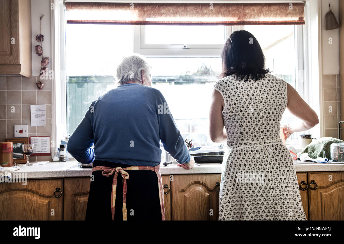 Mother washing dishes hi-res stock photography and images - Alamy