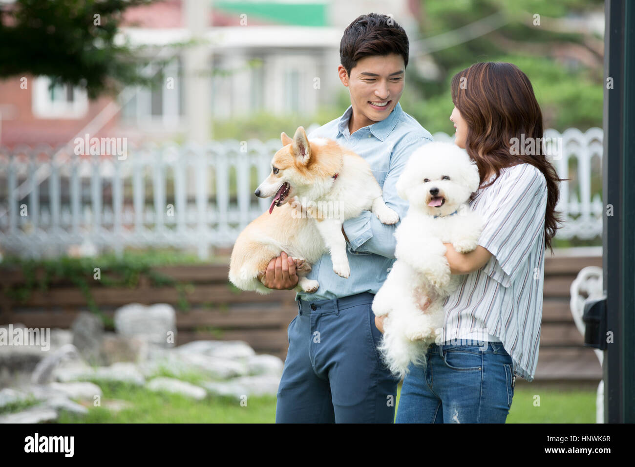 Young couple and dogs hi-res stock photography and images - Alamy