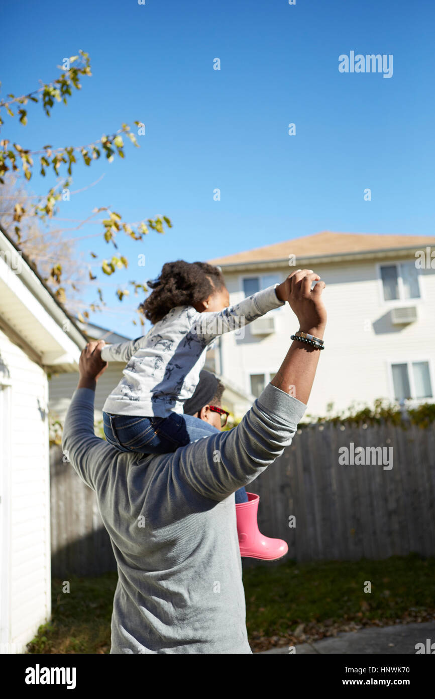 Man carrying child on shoulders hi-res stock photography and images - Alamy