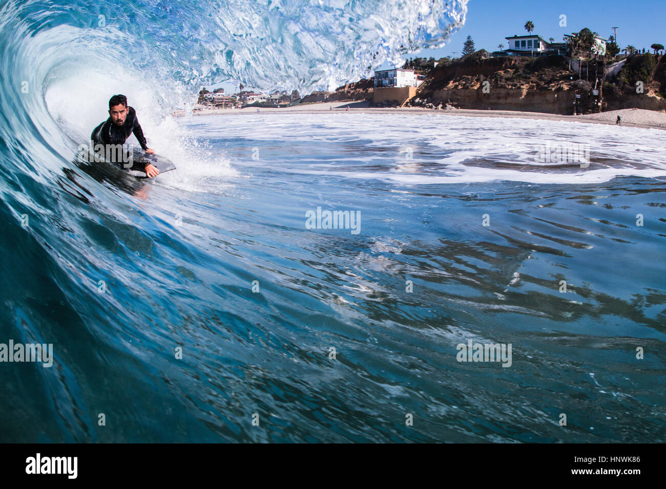 Man surfing in sea, Encinitas, California, USA Stock Photo - Alamy