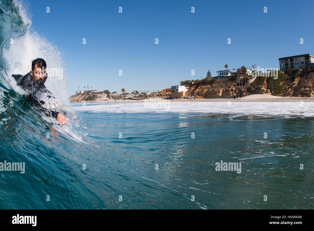 Man surfing in sea, Encinitas, California, USA Stock Photo - Alamy
