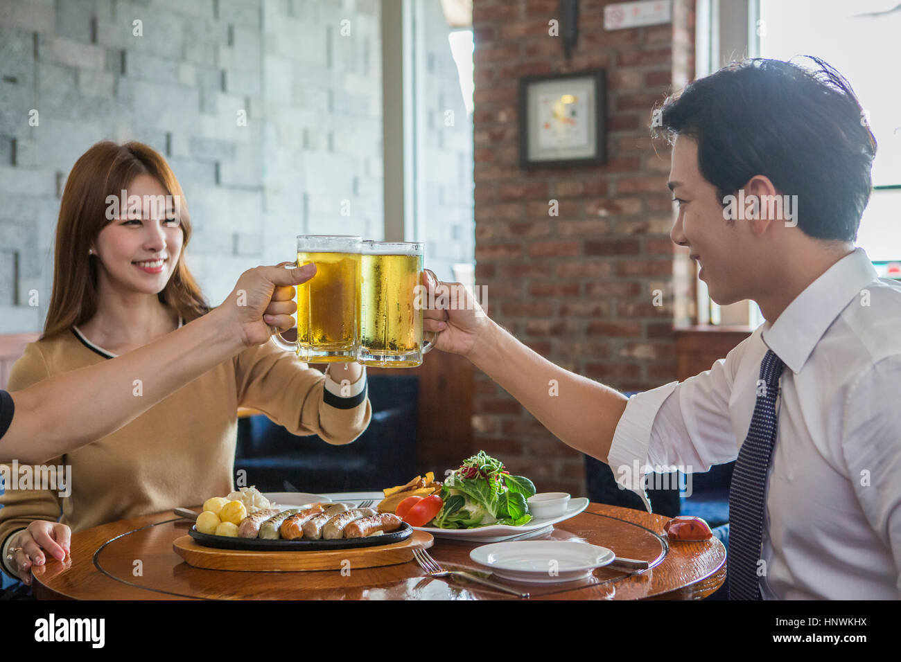 Smiling business people with beer Stock Photo - Alamy