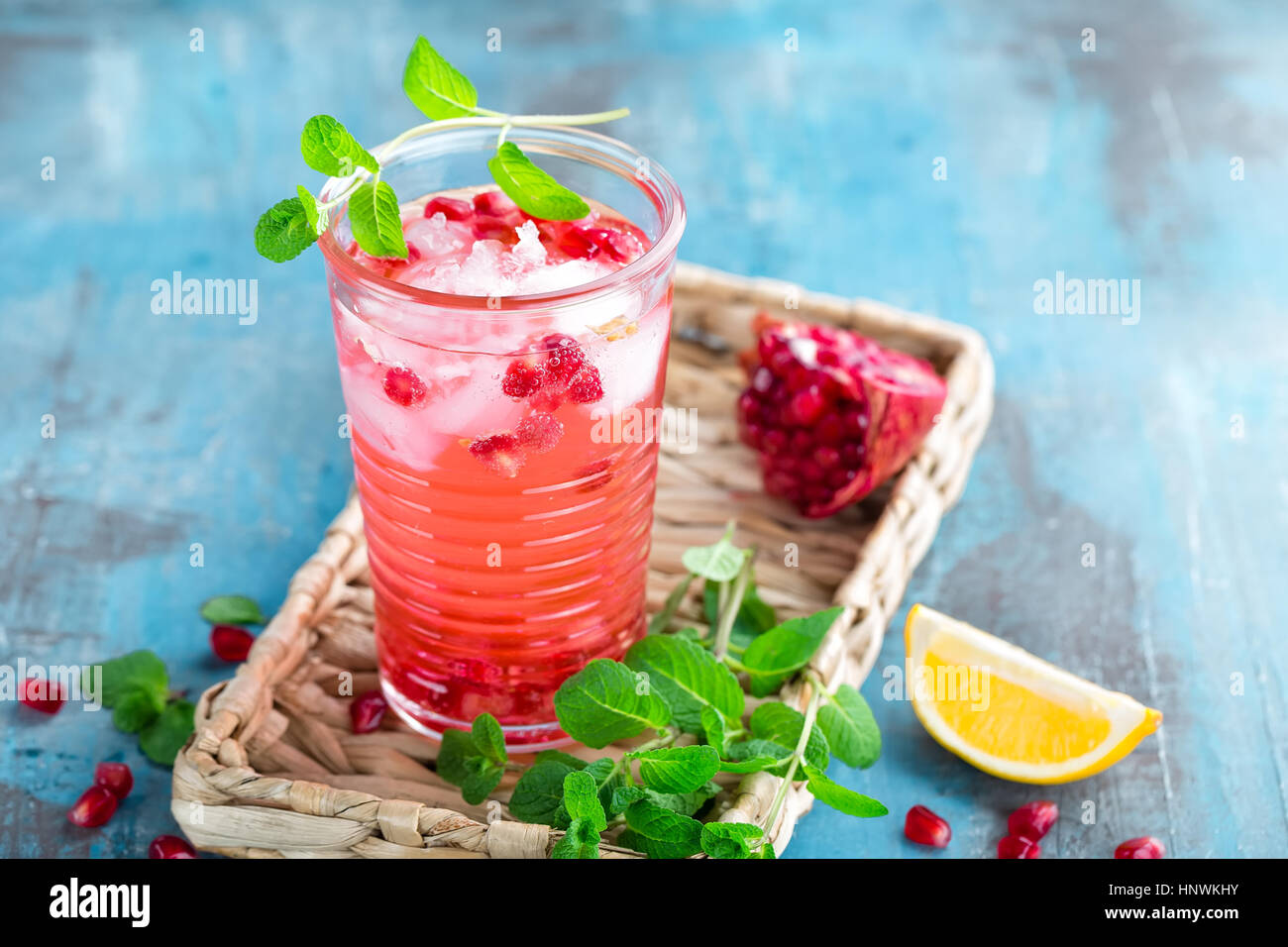Infused pomegranate water with fresh lemon and ice, cold healthy ...