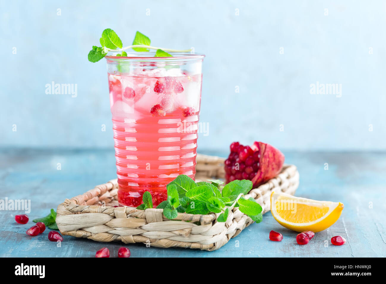 Infused pomegranate water with fresh lemon and ice, cold healthy ...