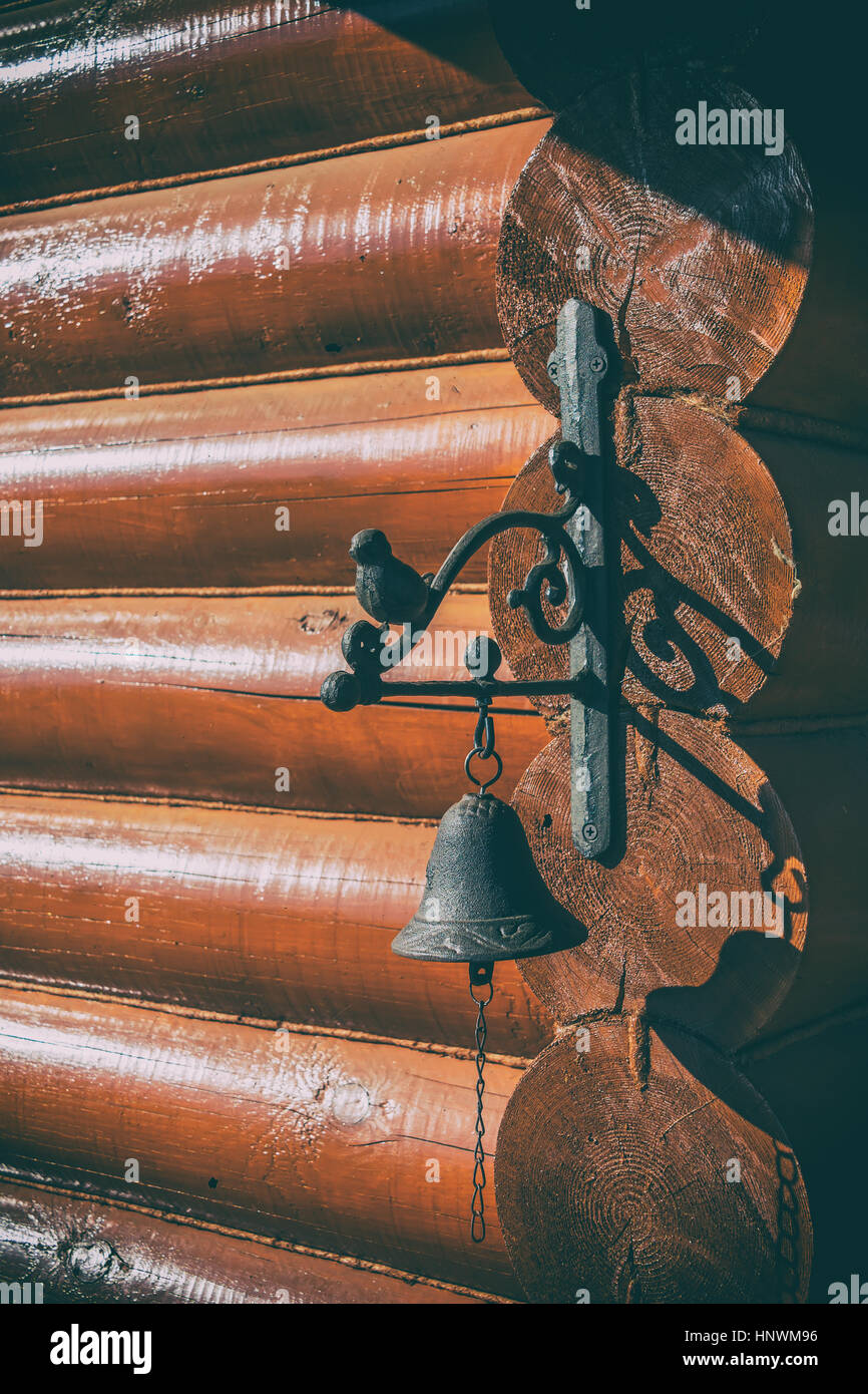 Old bronze bell on wooden wall Stock Photo - Alamy