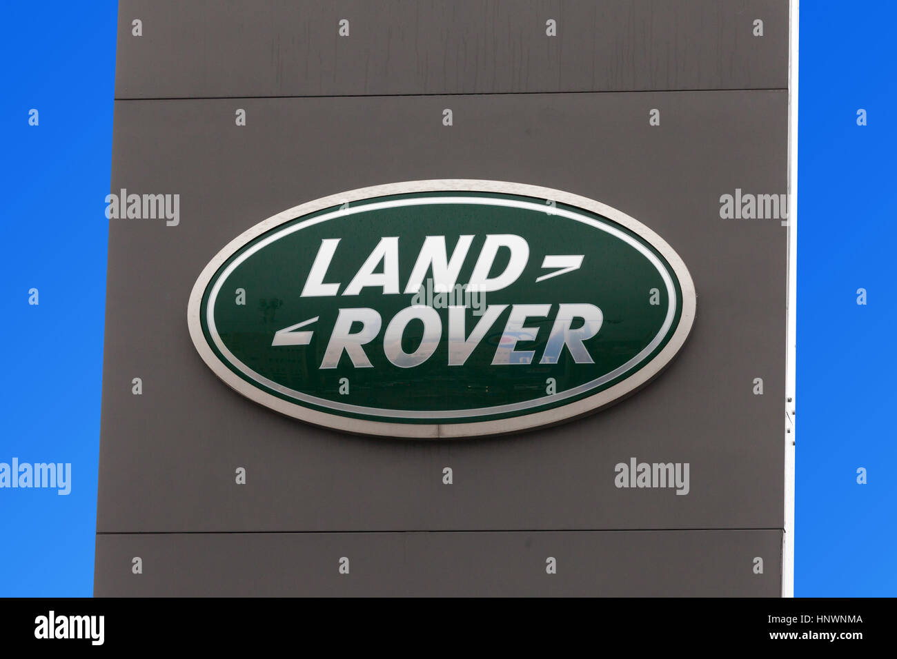 Land Rover sign. Land Rover is a car brand that specialises in four ...