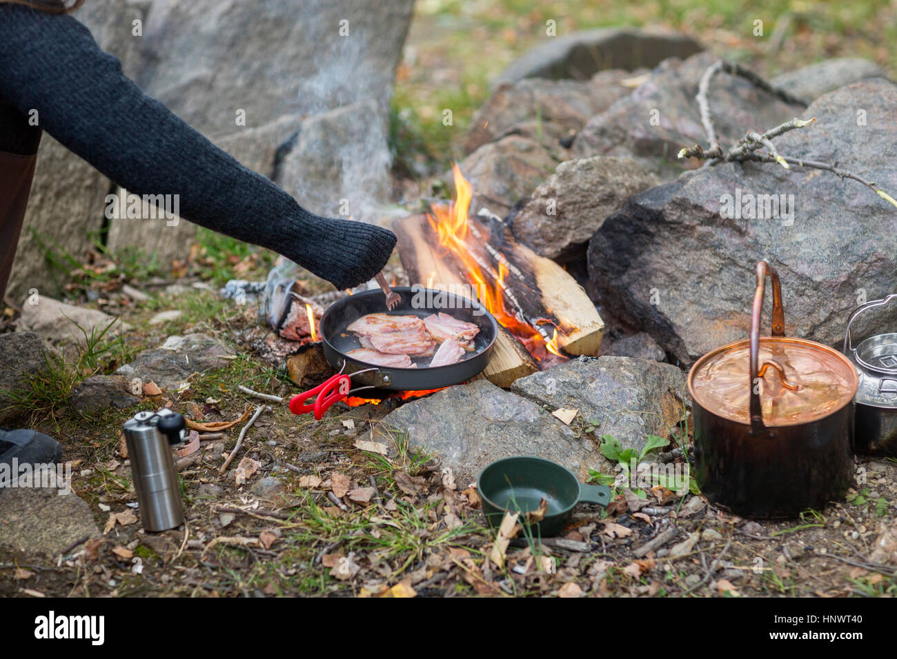 Woman cooking over fire hi-res stock photography and images - Alamy
