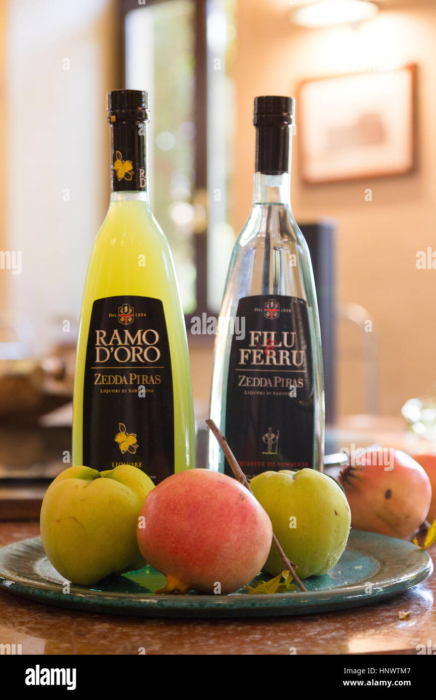 Two bottles of Italian liqueur (limoncello and grappa) on sale at the ...